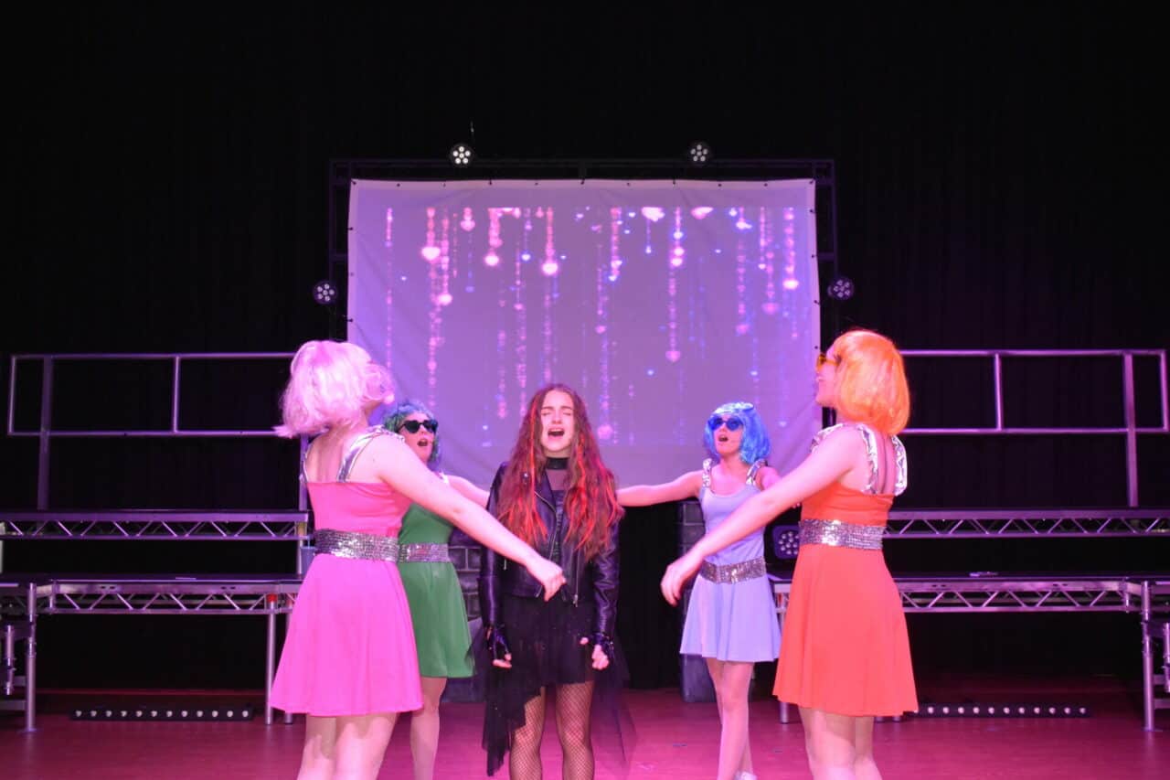 Students rock the stage in We Will Rock You School Edition - Laurus ...